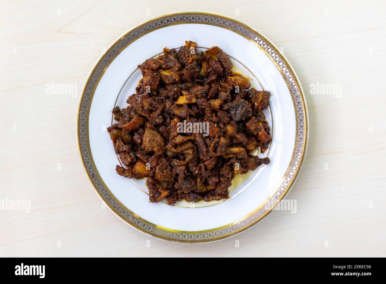 Tasty Bangladeshi food gorur bot bhaja or gorur vuri bhuna in a white ...