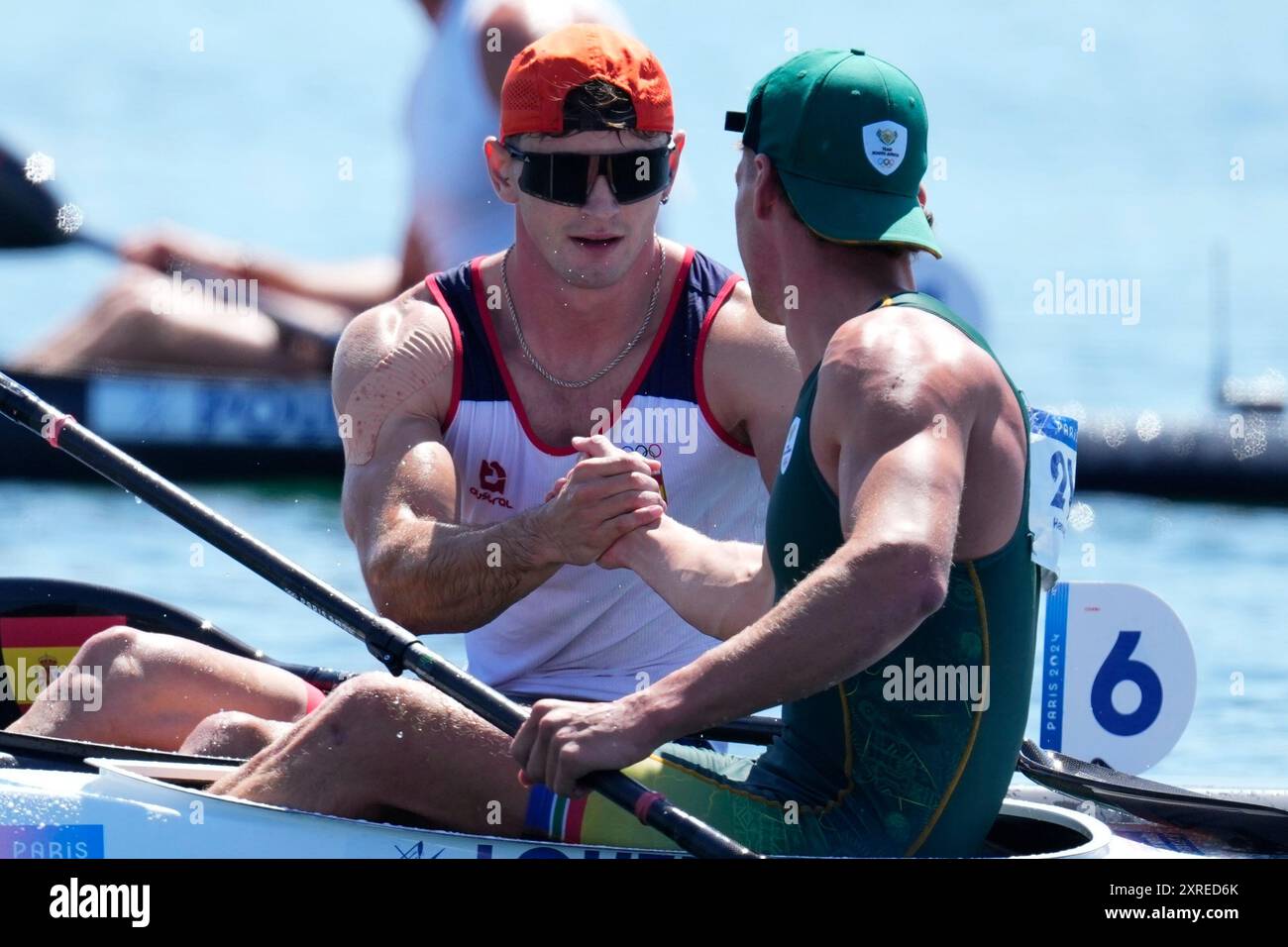 Hamish Lovemore, of South Africa, greets Adrian Del Rio, of Spain ...