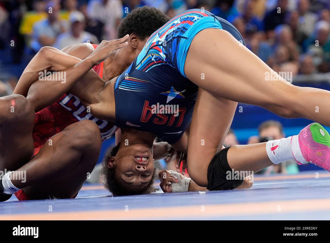 Cuba's De La Caridad Marin Potrille, in red, and Kennedy Alexis Blades ...