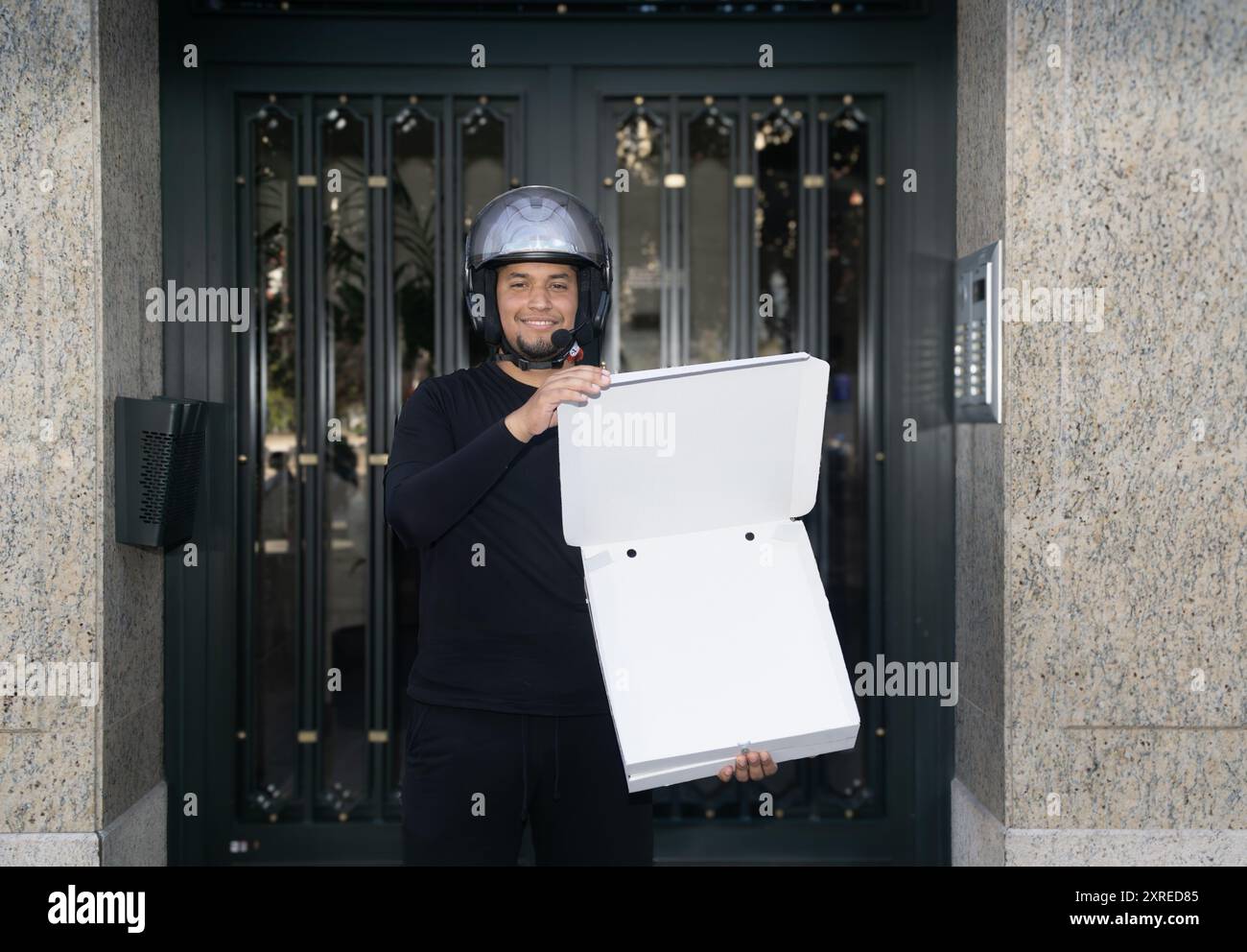 Cheerful smiling food delivery man hi-res stock photography and images ...