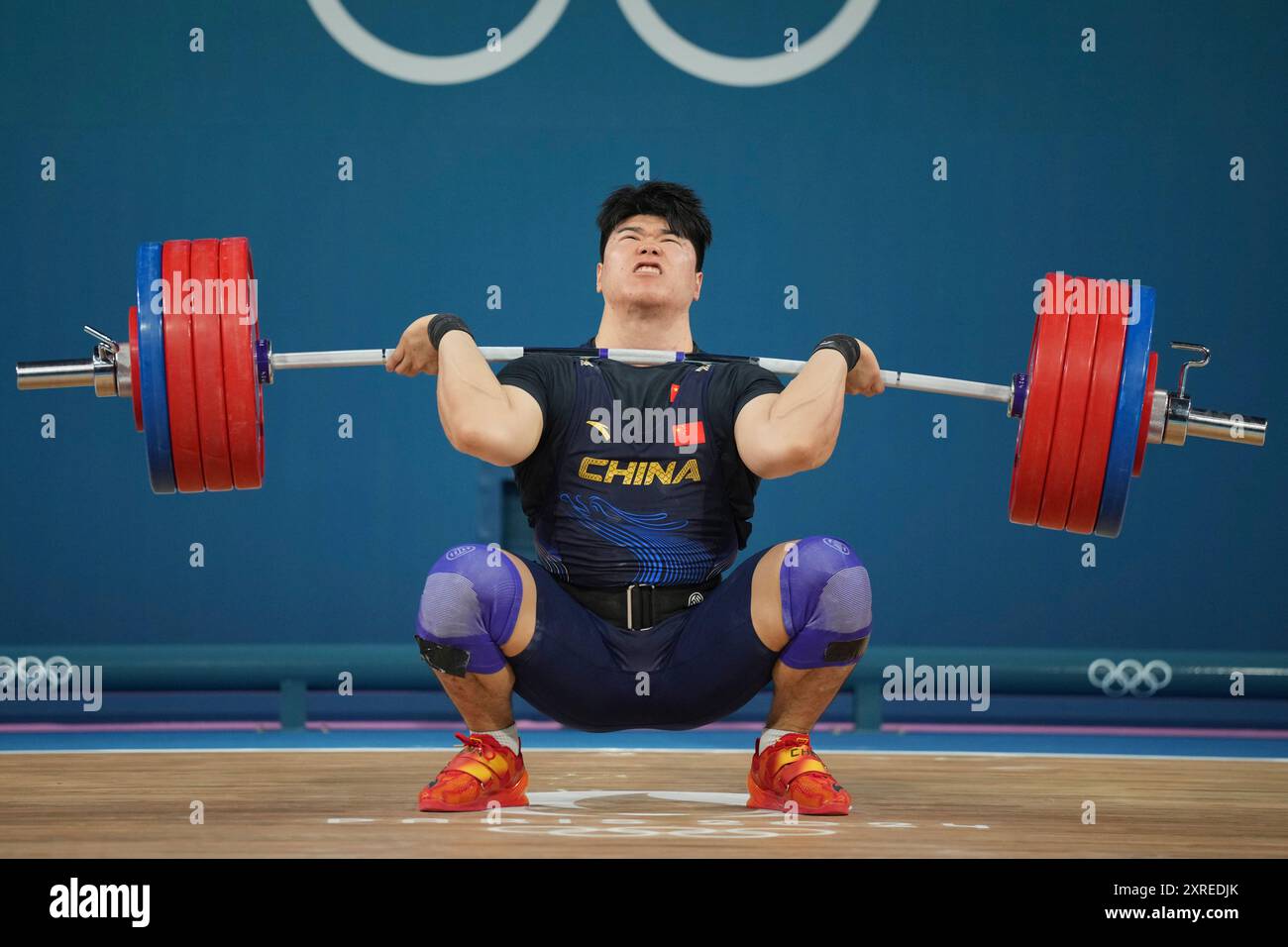 Liu Huanhua of China competes during the men's 102kg weightlifting ...