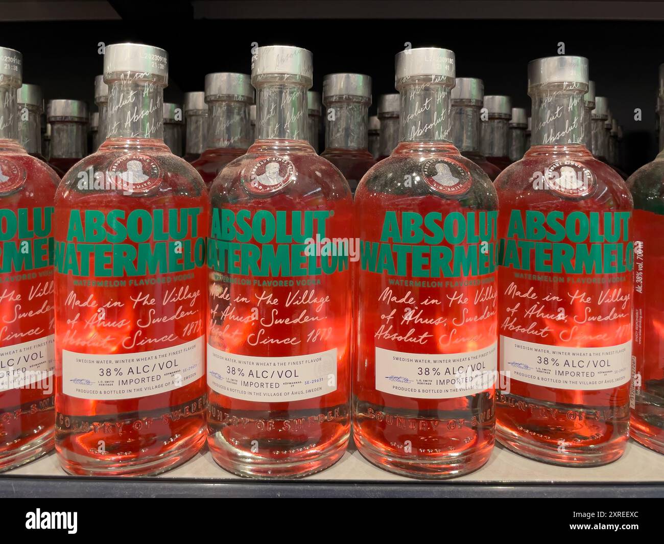 A row of Absolut Watermelon wolf bottles. The bottles are lined up on ...