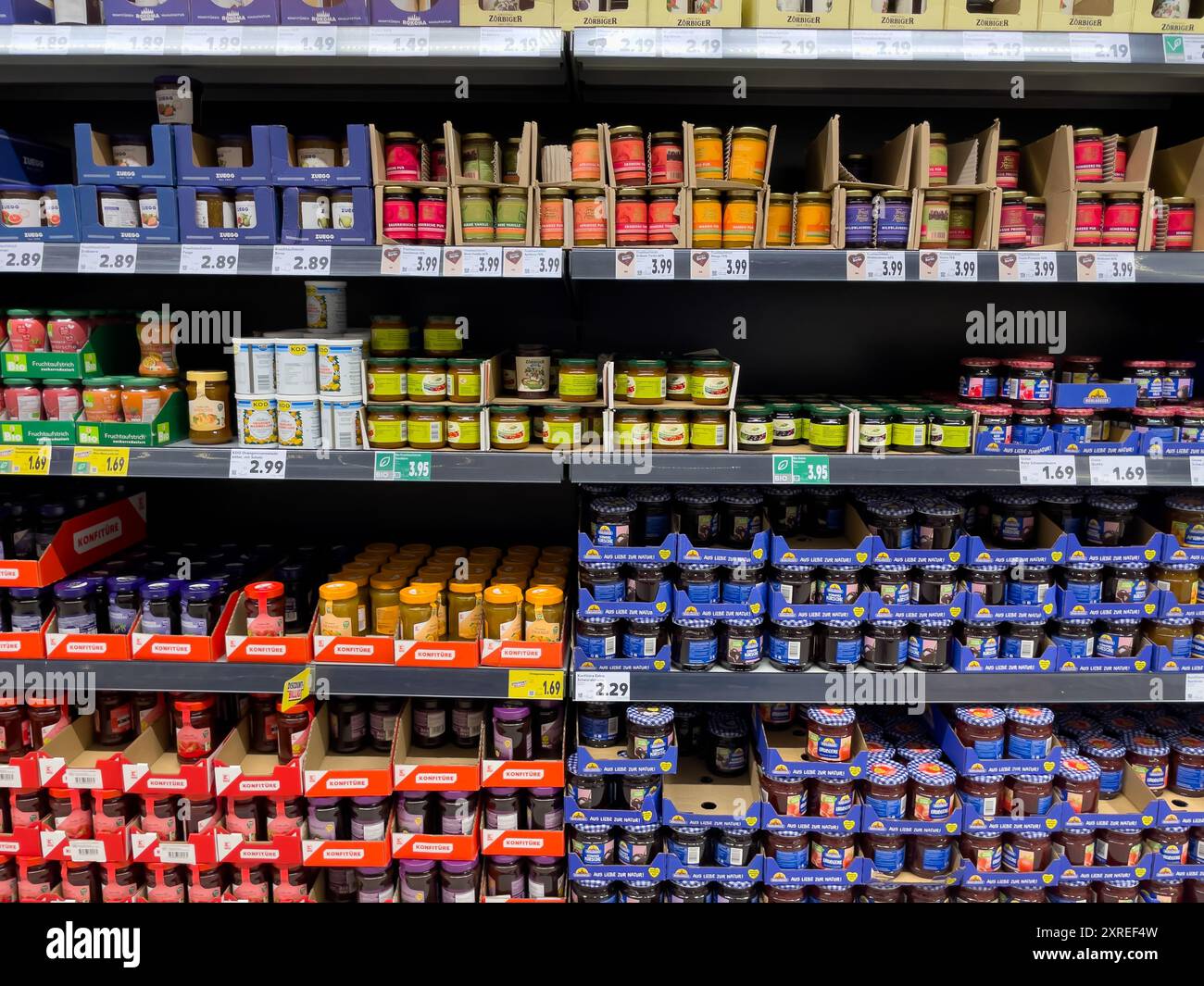 A store shelf with many different jars of jam. Jam jars come in ...
