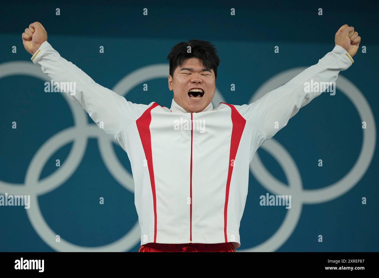 Gold medalist Liu Huanhua of China celebrates on the podium during the ...