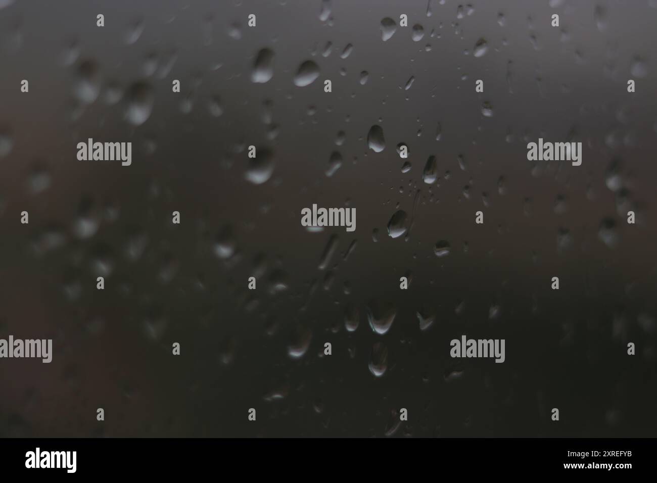 Raindrops on window symbolizing hi-res stock photography and images - Alamy