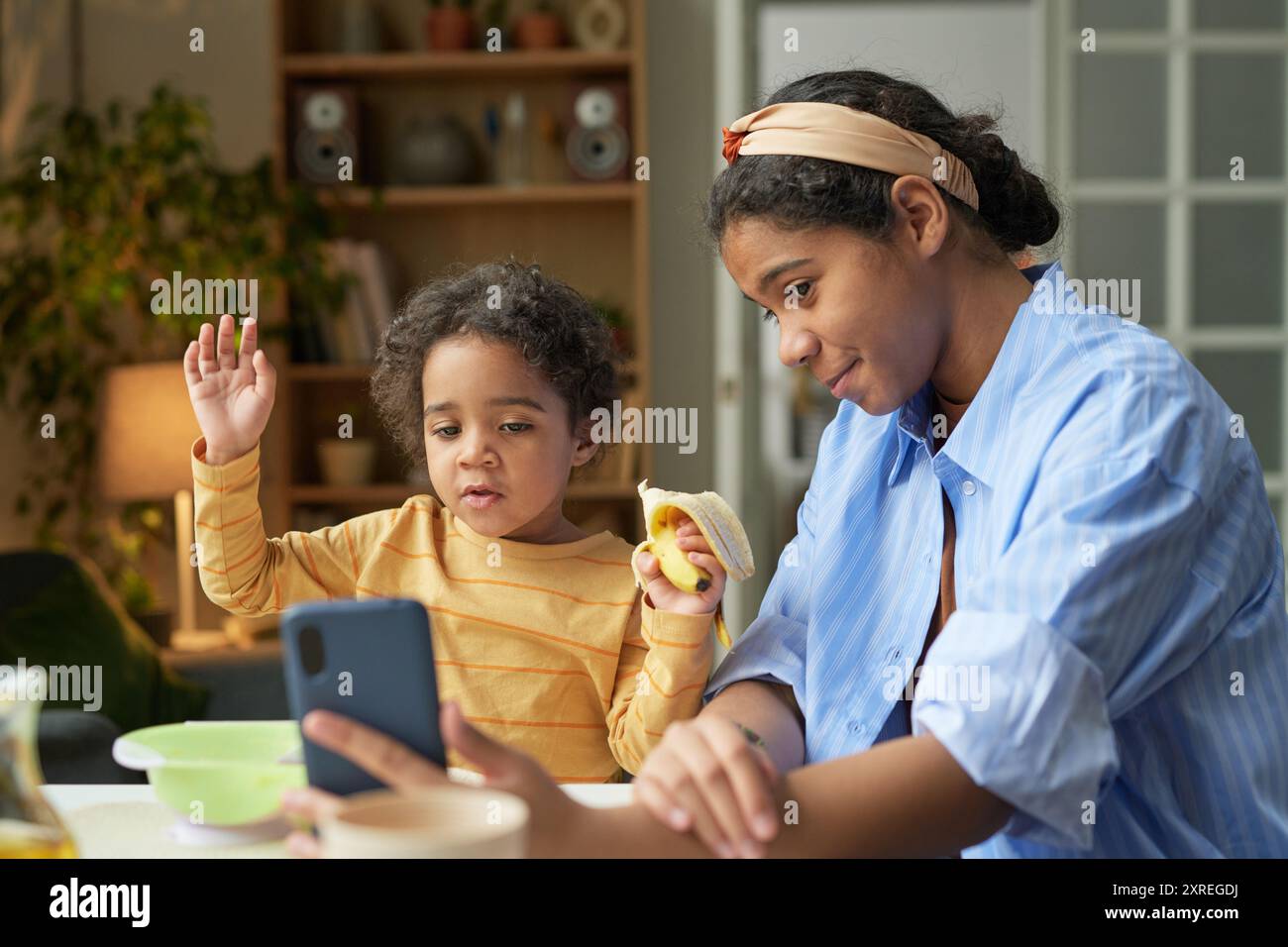 Modern Parenting: Sharing Moments with Child Using Technology Stock ...