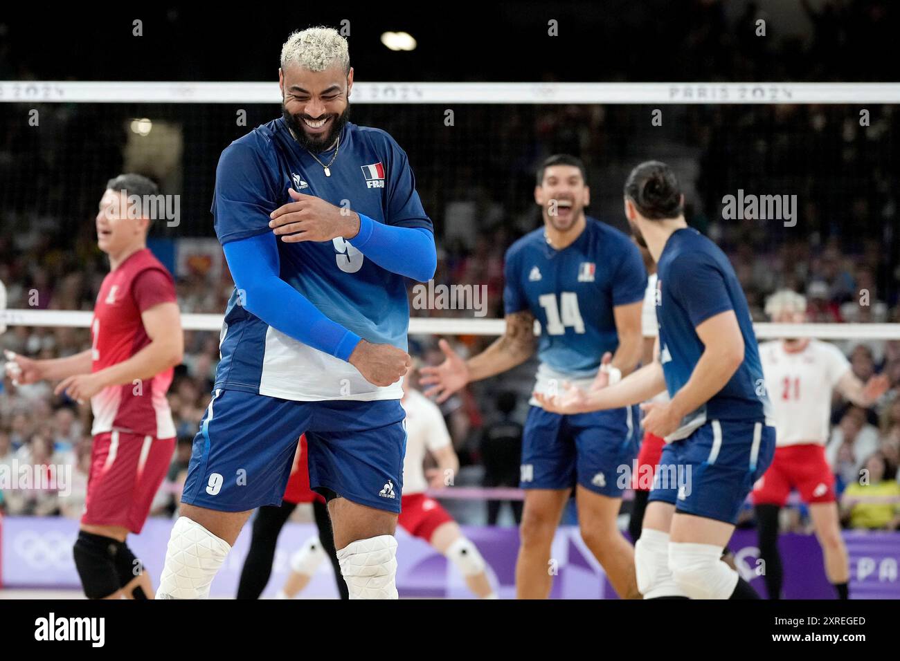 French players celebrate after winning the second set during a gold ...