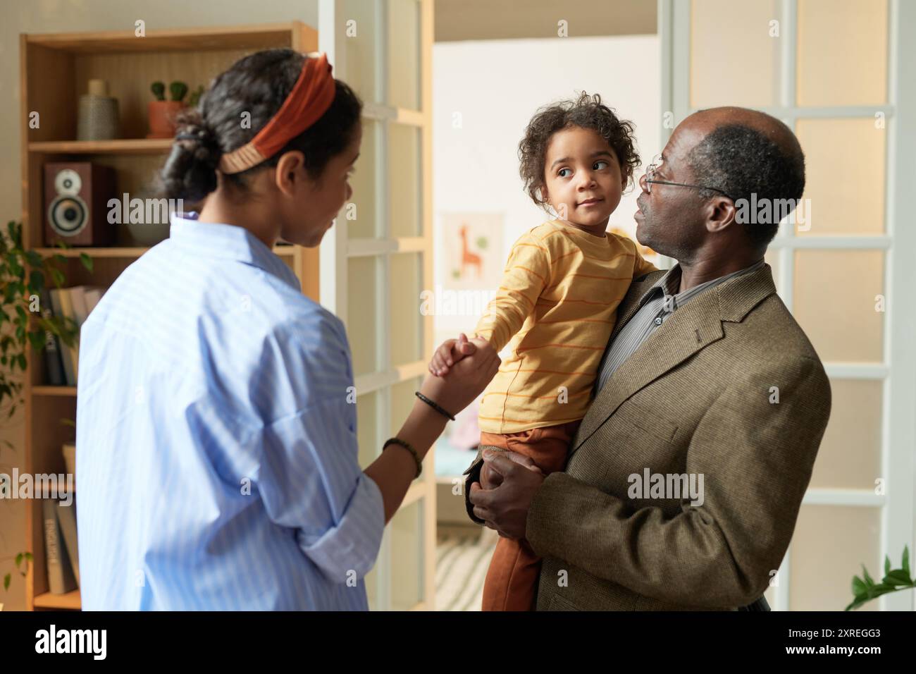 Family Bonding Moment in Cozy Home Setting Stock Photo - Alamy