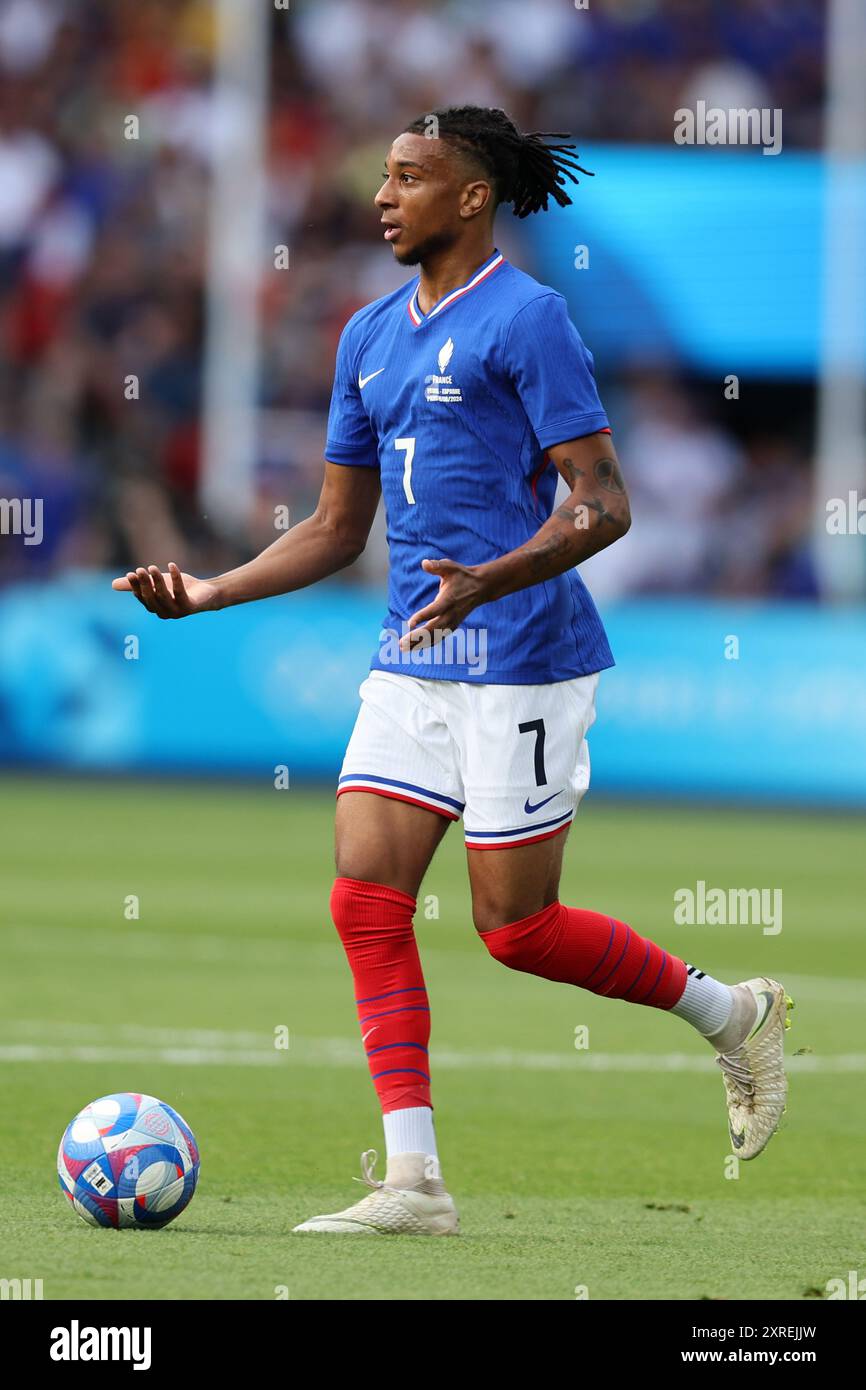 PARIS, FRANCE - AUGUST 09: Michael Olise of of Team France runs with a ...