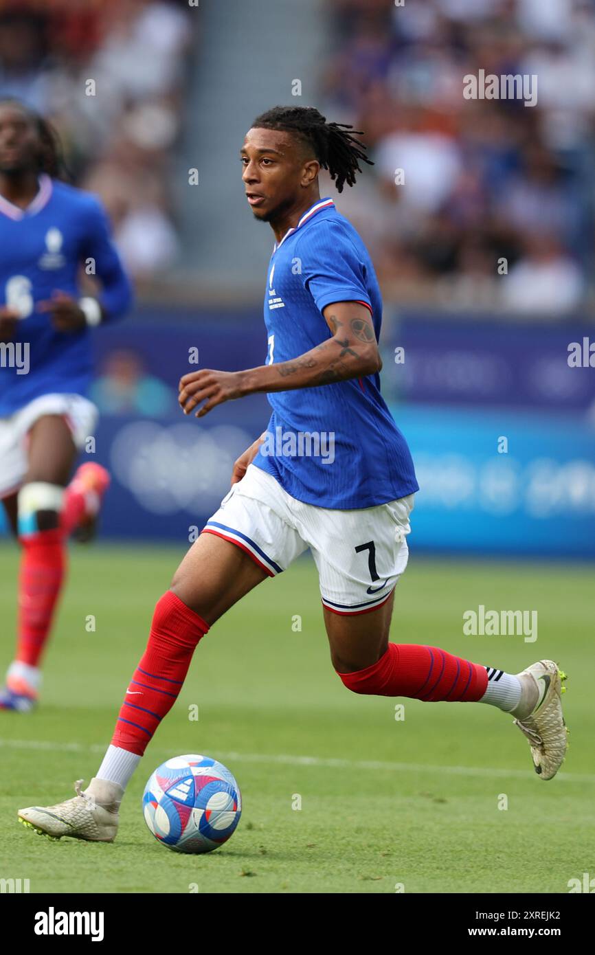 PARIS, FRANCE - AUGUST 09: Michael Olise of of Team France runs with a ...