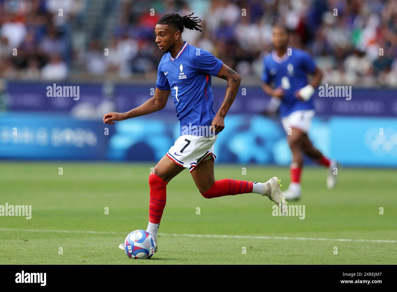 PARIS, FRANCE - AUGUST 09: Michael Olise of of Team France runs with a ...
