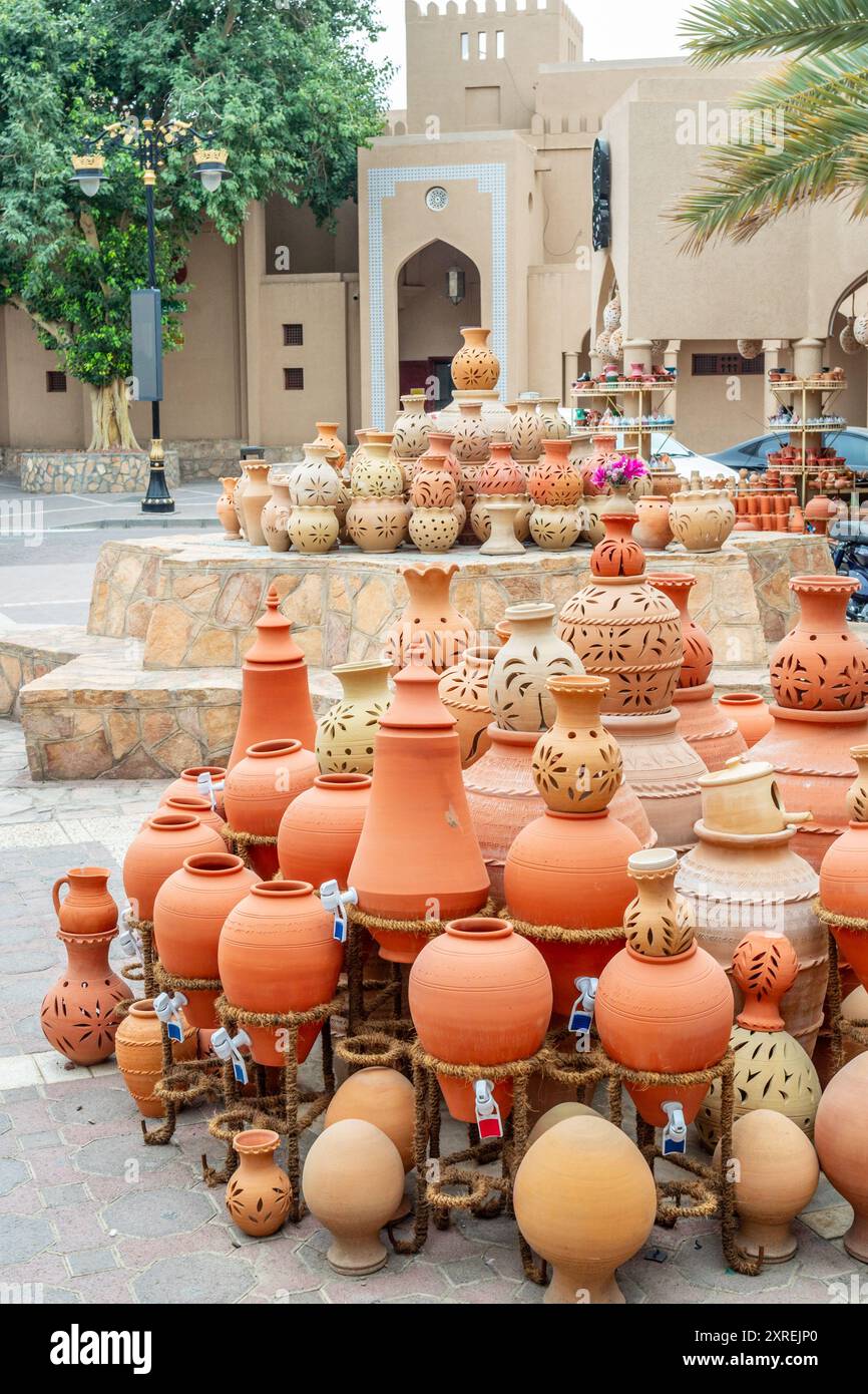 Handmade pottery jugs trade market on the street of Nizwa, Sultanate ...