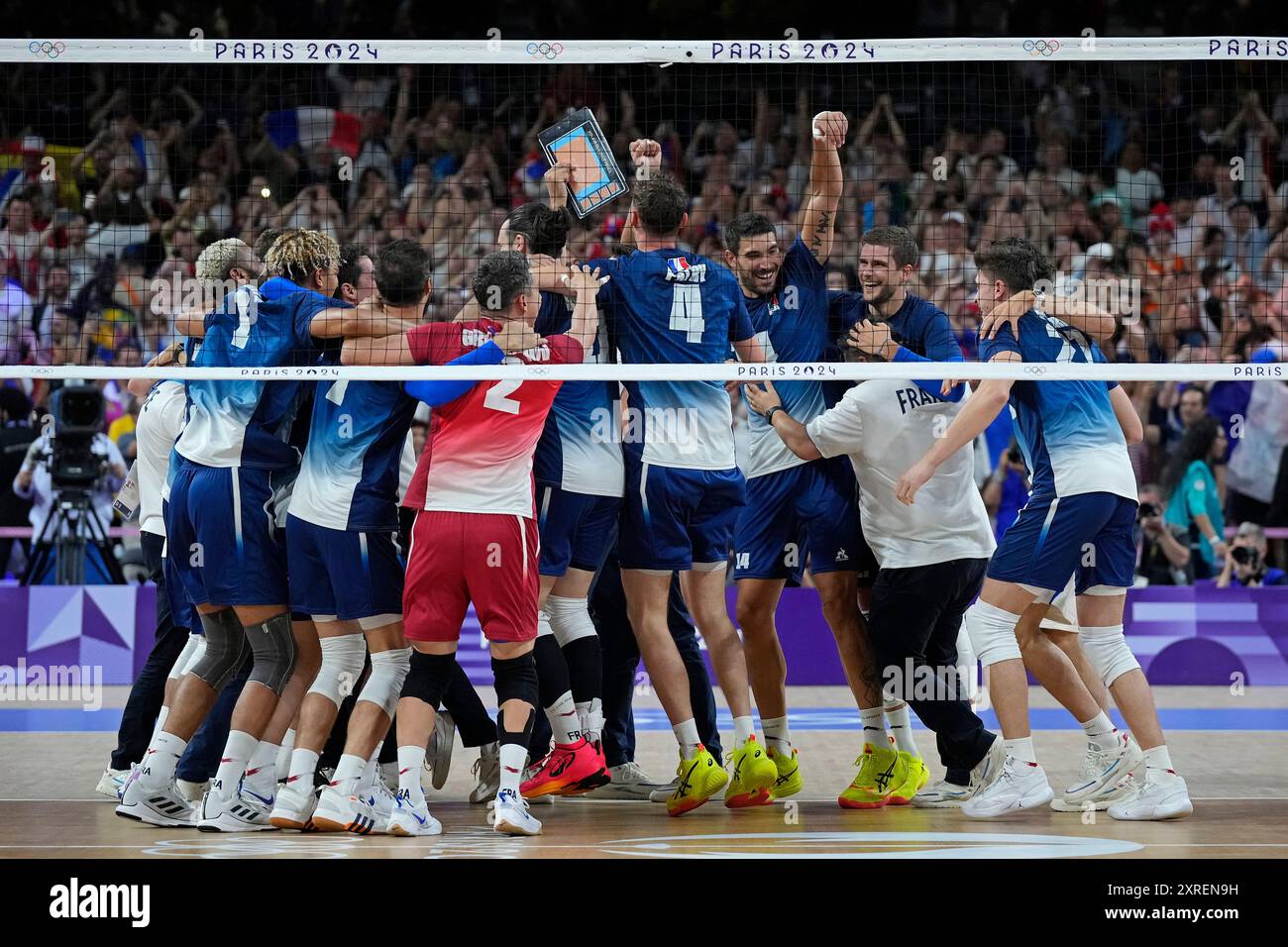 The French team celebrates after beating Poland in a gold medal men's ...