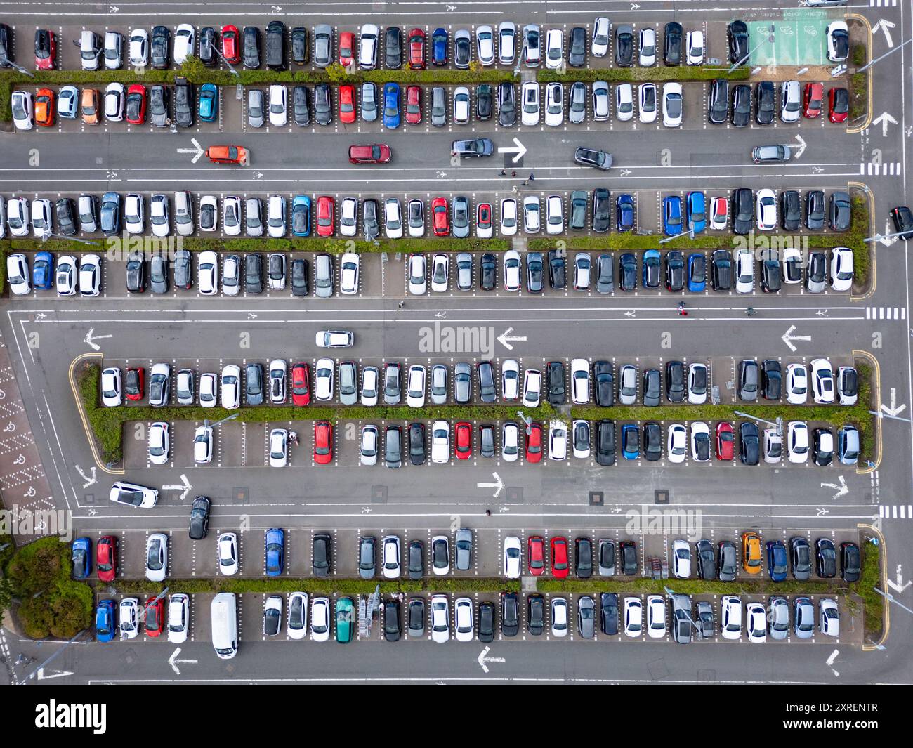 Aerial view of many cars in busy car park at large shopping mall ...