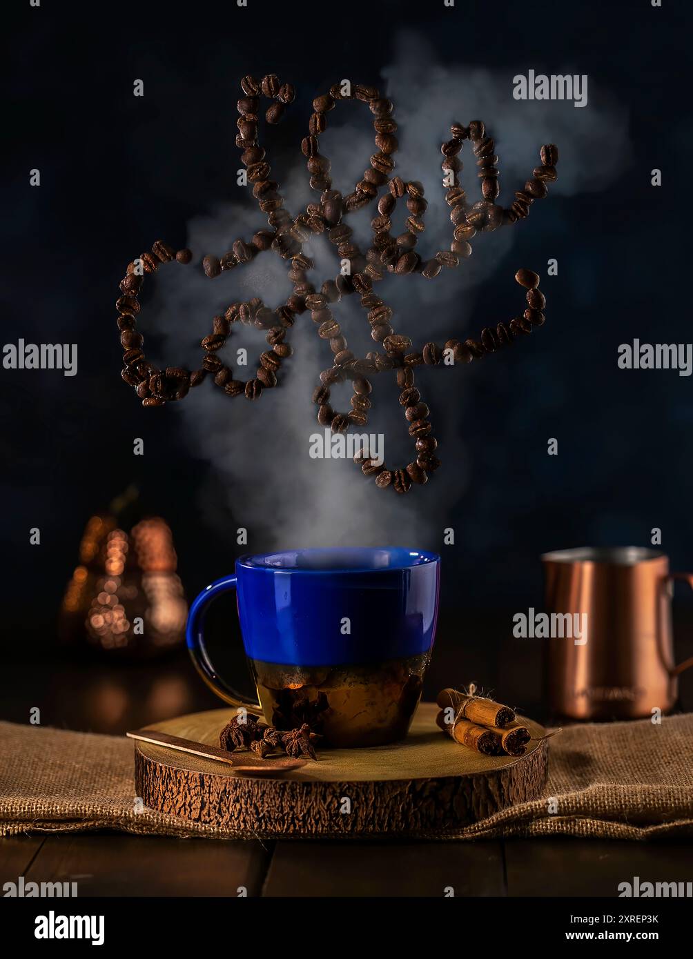 real coffee bean sign over coffee mug with steam Stock Photo - Alamy