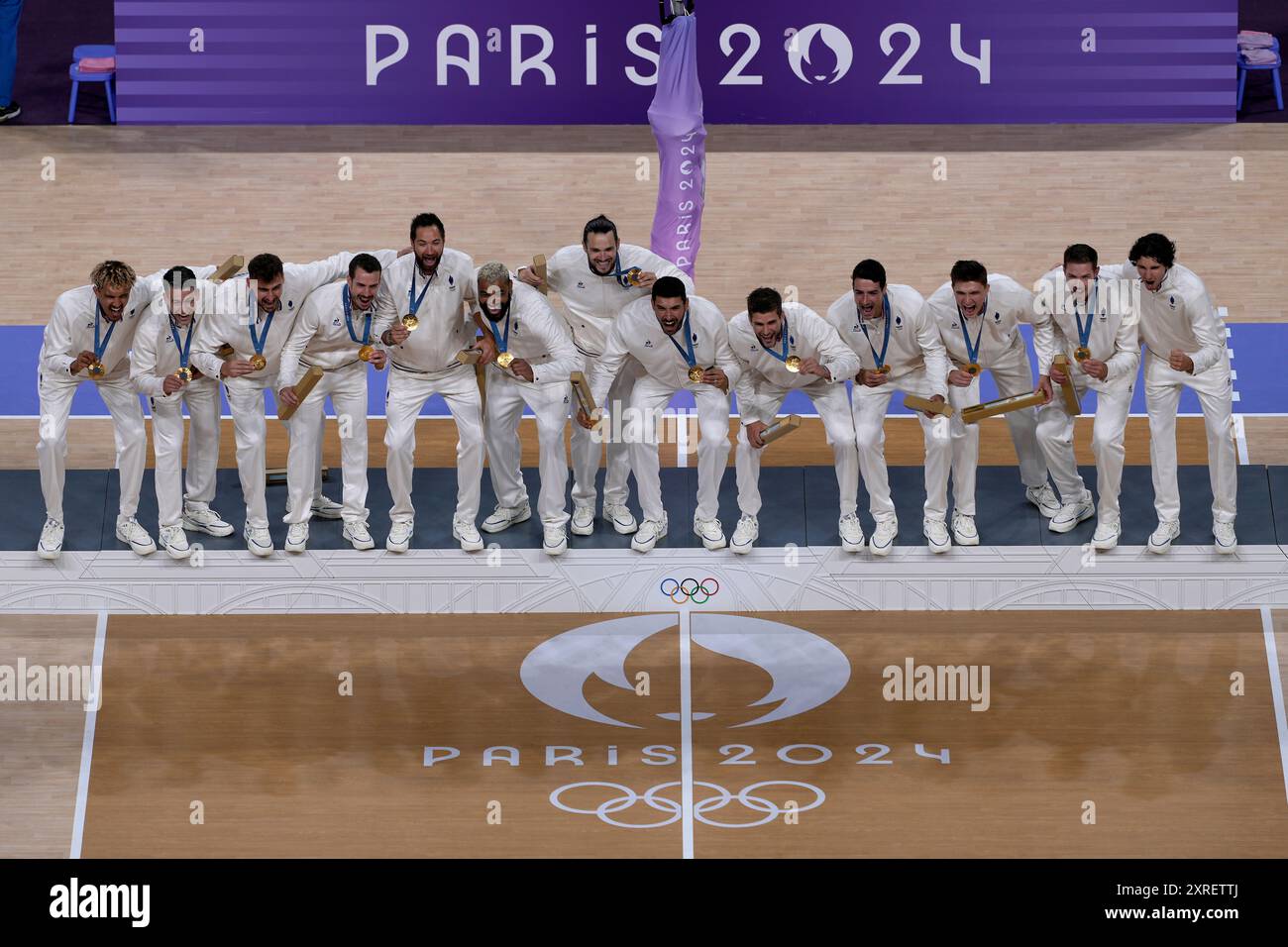 The French team poses with their gold medals after beating Poland in ...