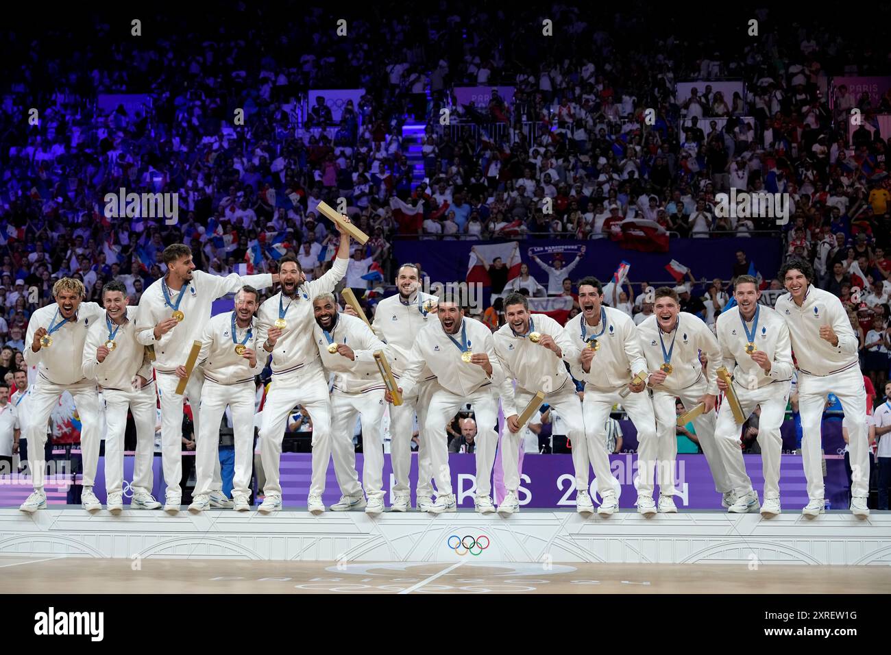 The French team poses with their gold medals after beating Poland in ...
