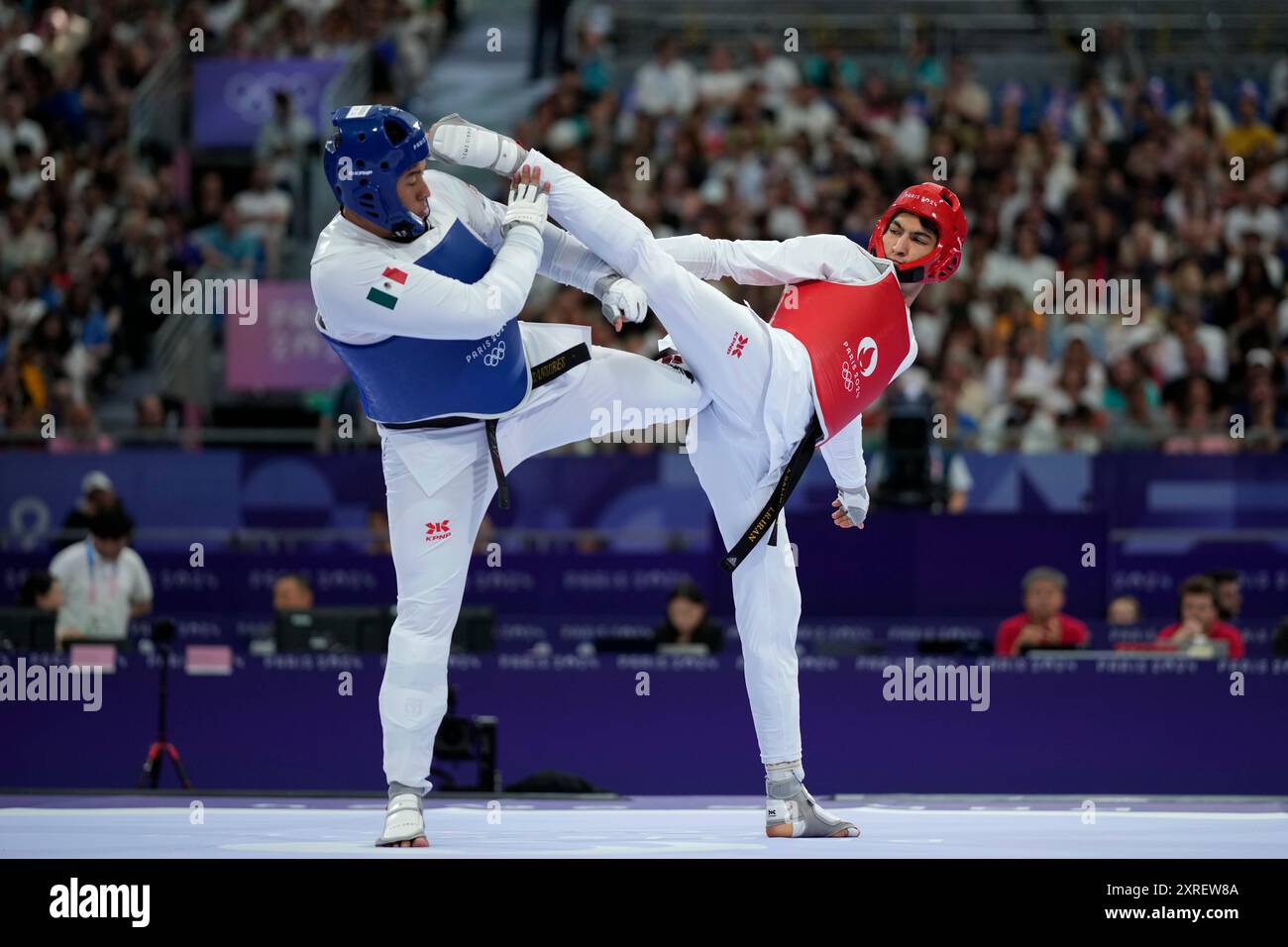 Mexico's Carlos Sansores competes with Iran's Arian Salimi in a men's ...