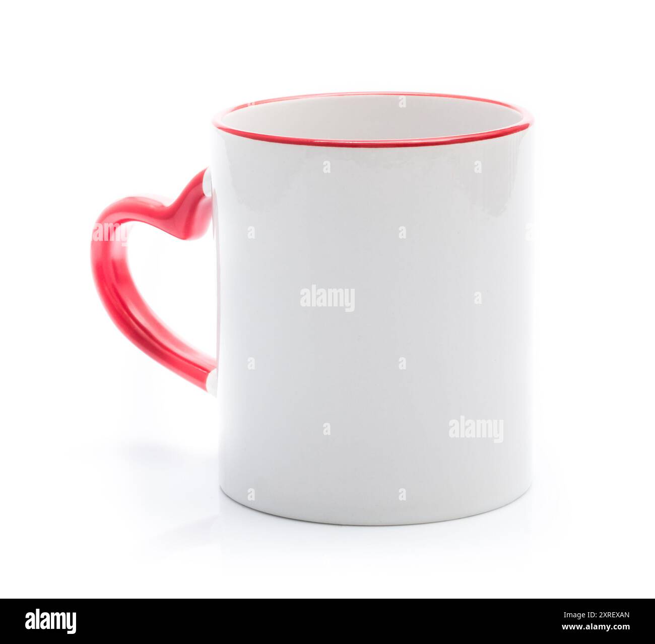 White cup with red rim and handle in heart shape isolated on a white ...