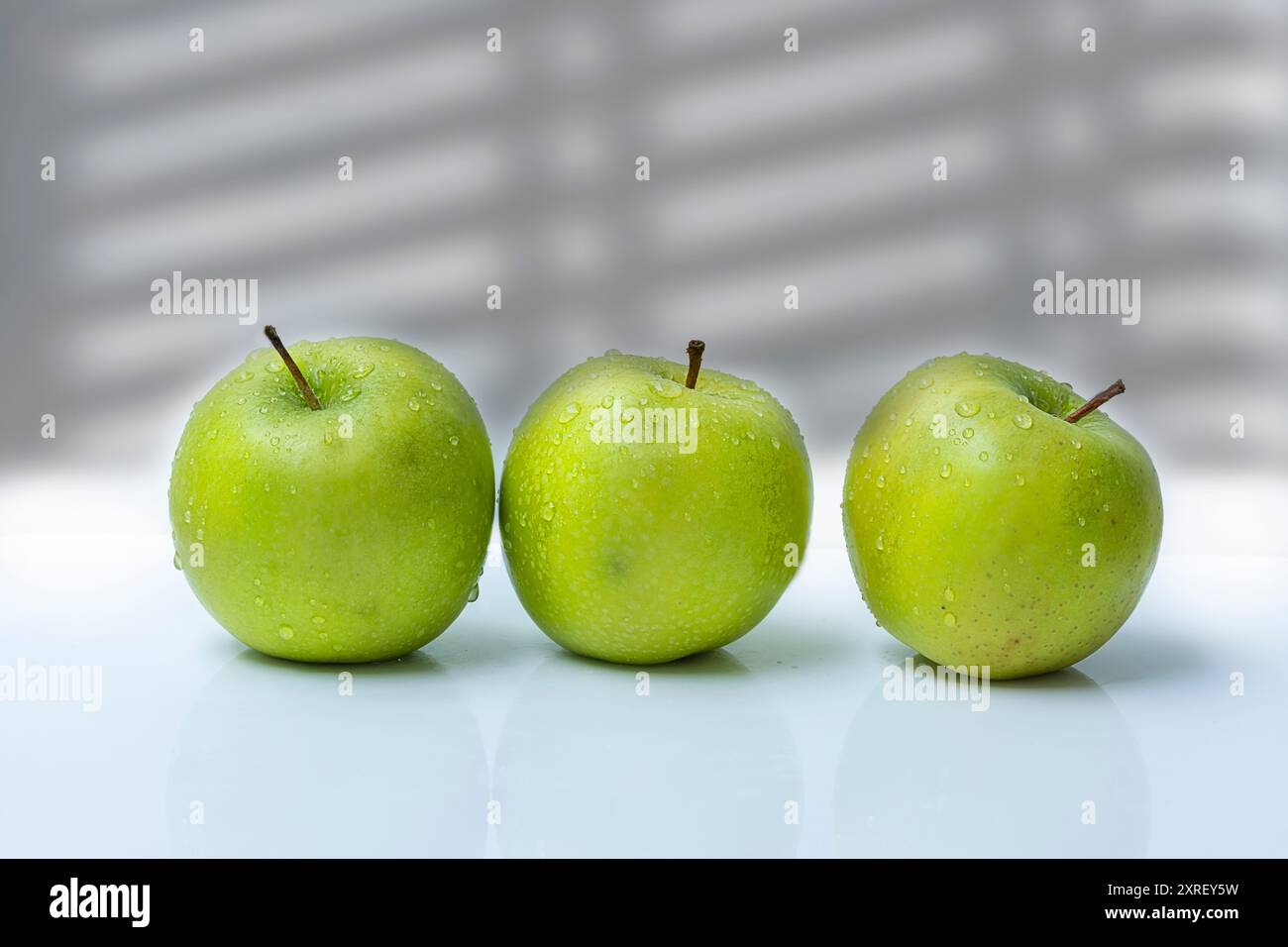 Three green apples still-life photograph Stock Photo - Alamy
