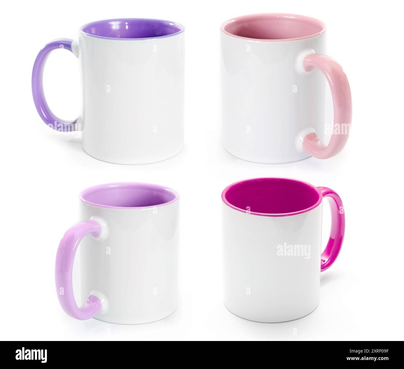 Set of white cups with pink inner side and handle isolated on a white ...