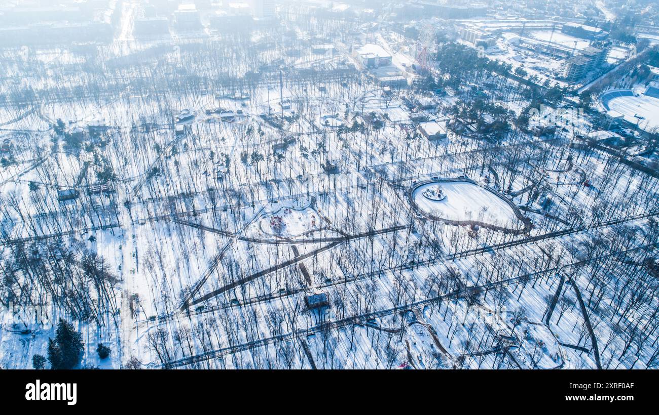 Top view of central city park during winter with snow. Aerial view of ...