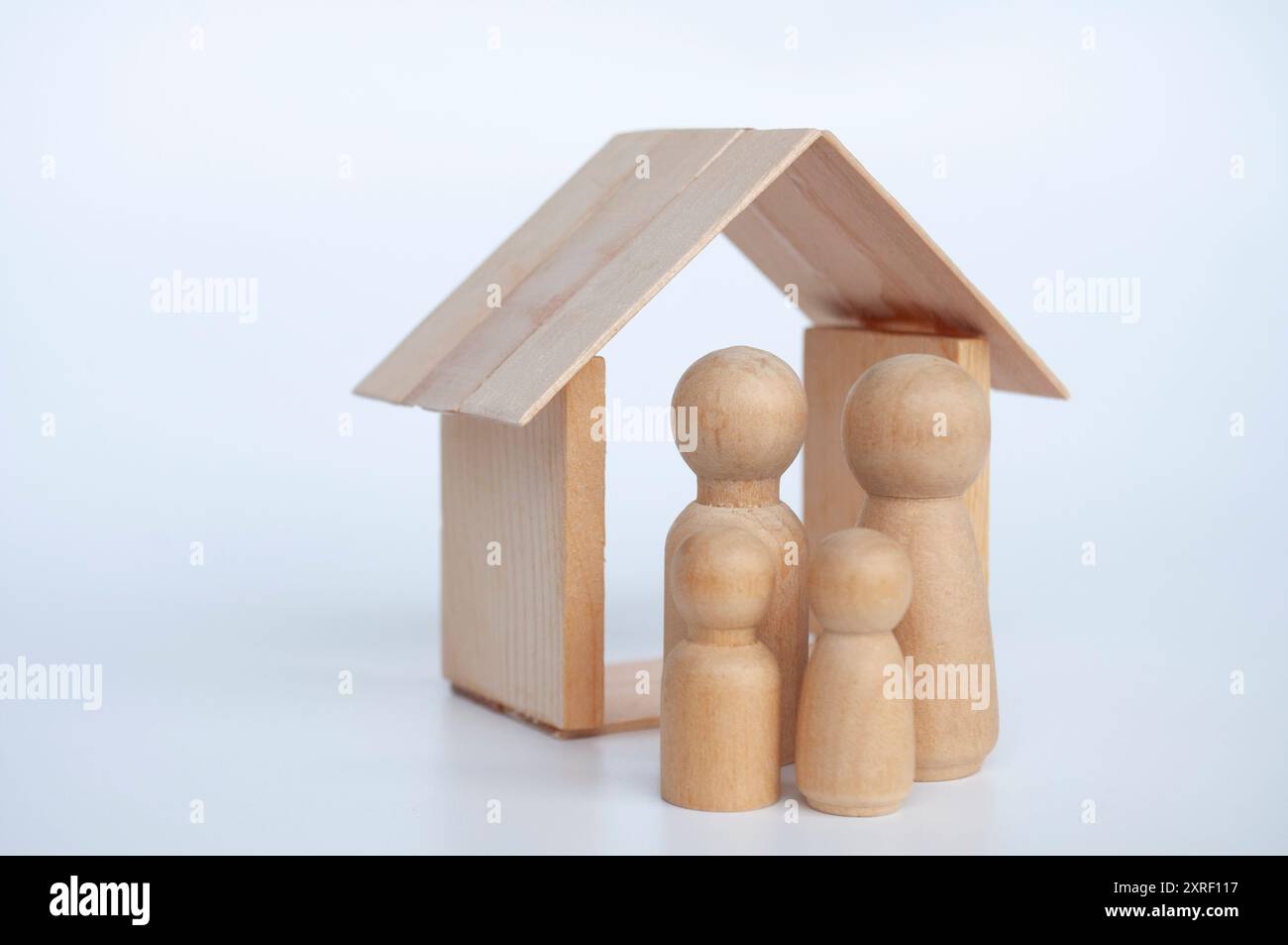 Family figure with wooden house background. Insurance concept Stock ...