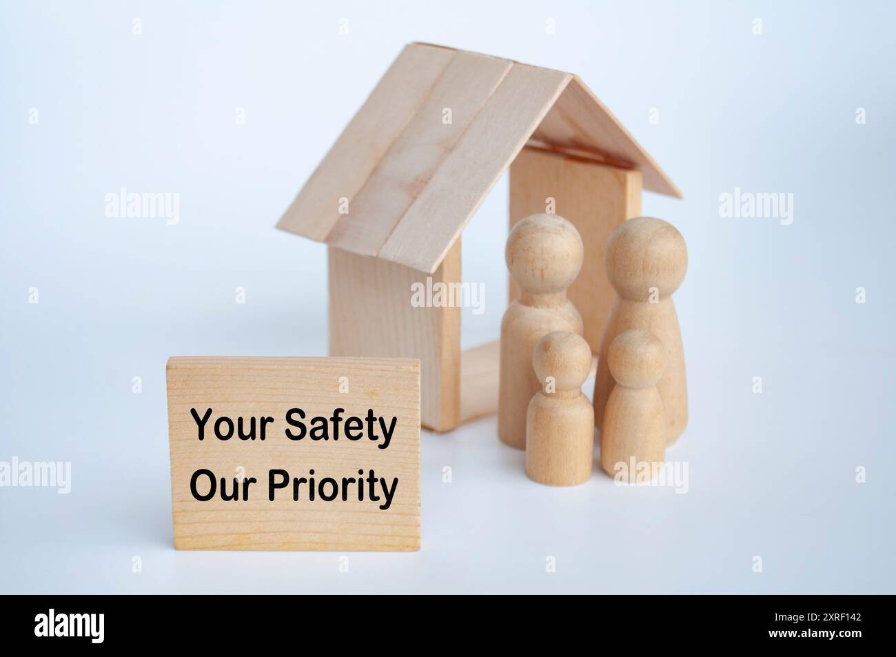 Your Safety Our Priority text on wooden blocks with wooden doll family ...