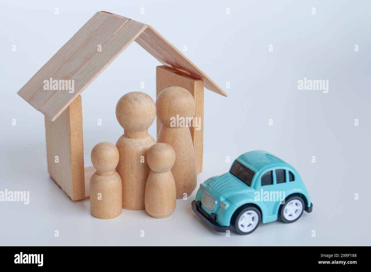 Insurance concept with family figure, blurred car background Stock ...