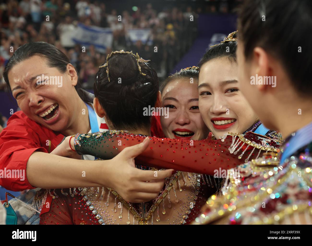 Paris, France. 10th Aug, 2024. Members of Team China react after the ...