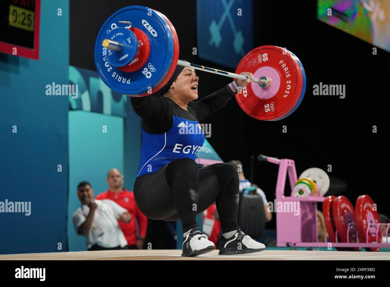 Sara Ahmed of Egypt competes during the women's 81kg weightlifting ...
