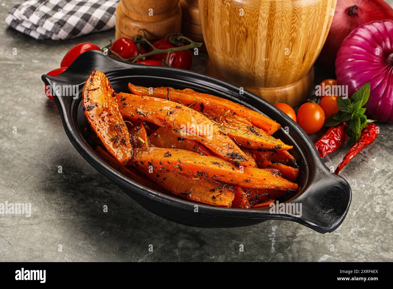 Baked batat with with spices in the plate Stock Photo - Alamy