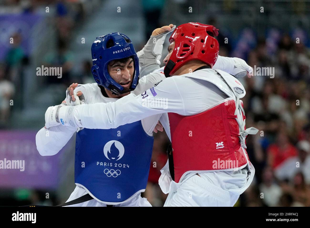 Iran's Arian Salimi competes with Croatia's Ivan Sapina in a men's over ...