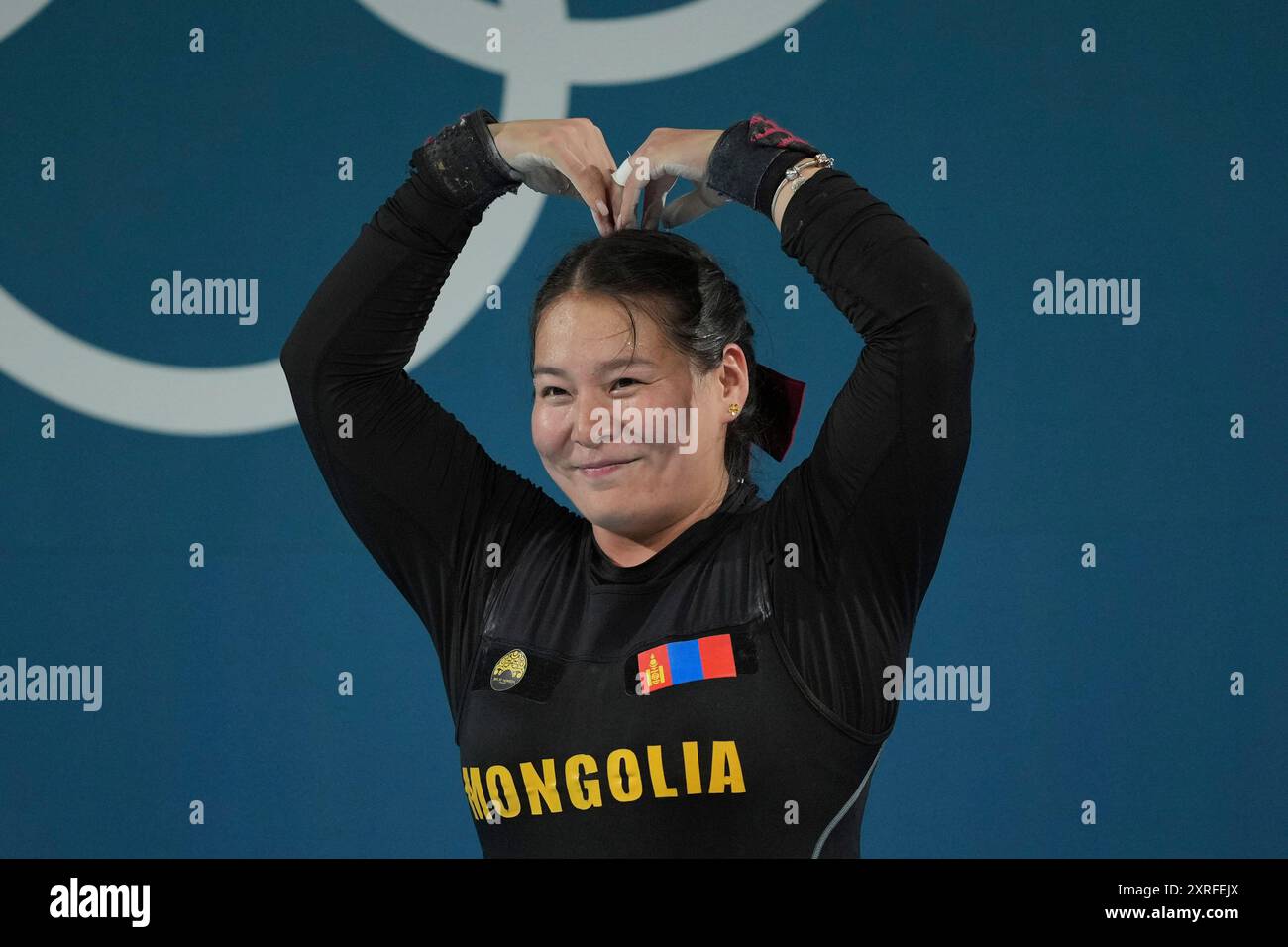 Ankhtsetseg Munkhjantsan of Mongolia reacts after a good lift during ...