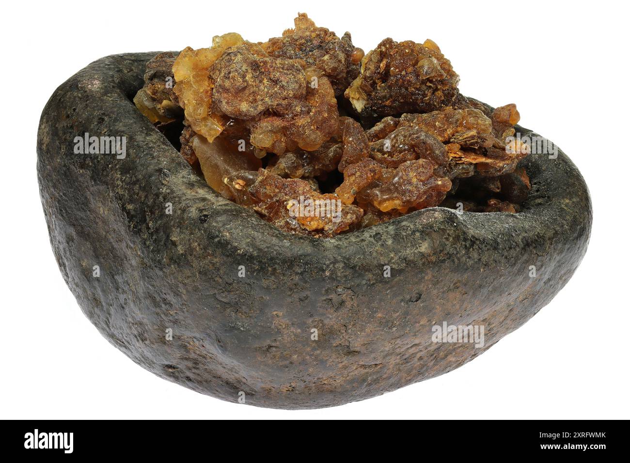 myrrh resin from Oman in a stone bowl isolated on white background ...