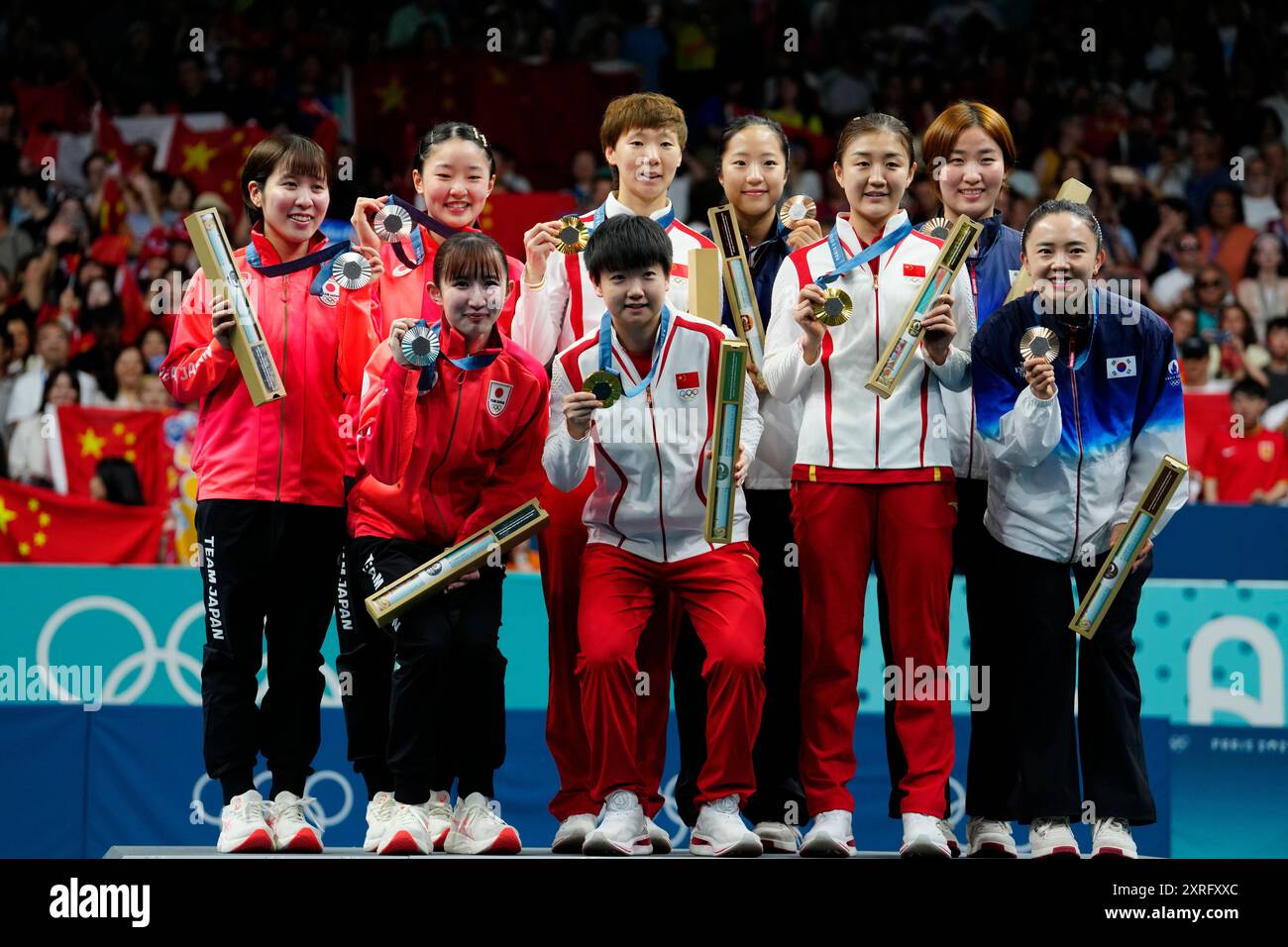 China gold medalists, center, Japan silver medalists, left, and South Korea bronze medalists ...