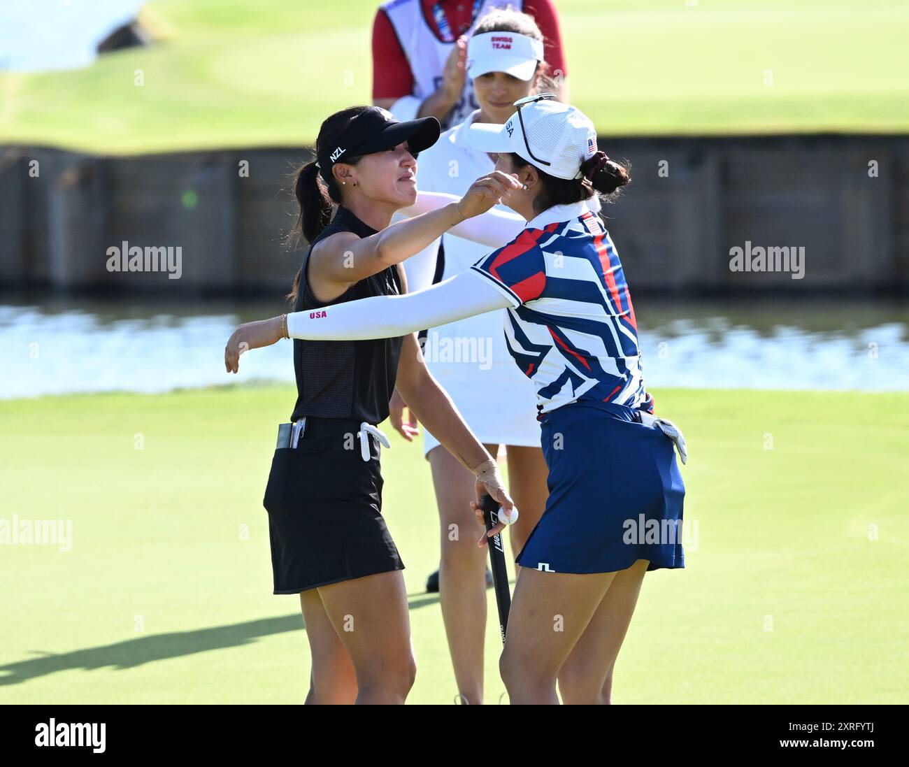 KO Lydia of New Zealand (L) is celebrated after winning the golf women ...