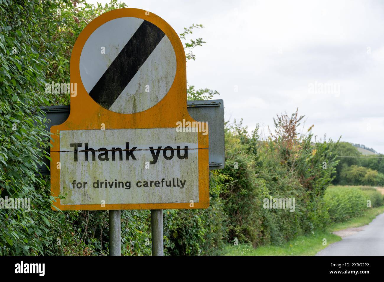 Road sign on leaving village reading Thank You for driving carefully ...