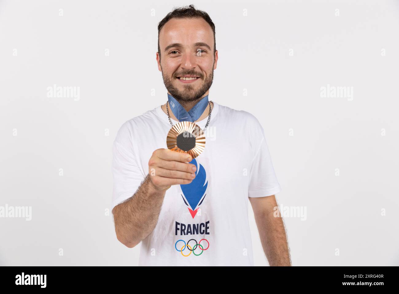 France's men table tennis team bronze medalist Simon Gauzy poses for a ...