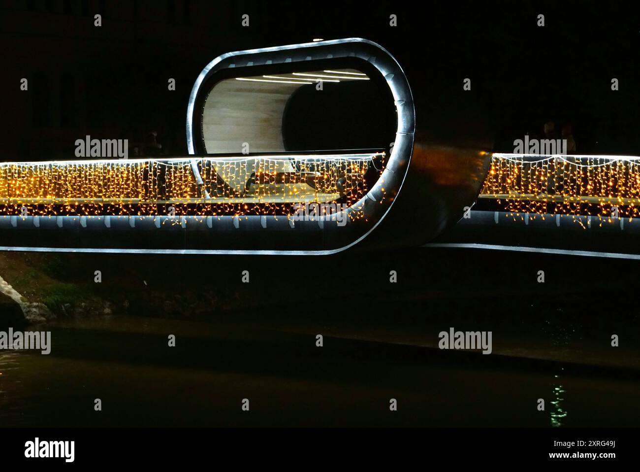 Night views of festive Sarajevo: modern and unusual bridge Festina ...