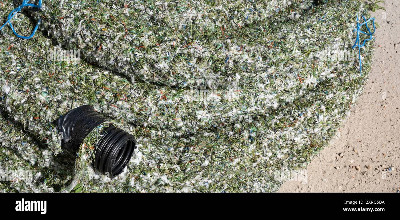 Coiled back plastic drainage pipe wrapped with artificial grass fibre ...