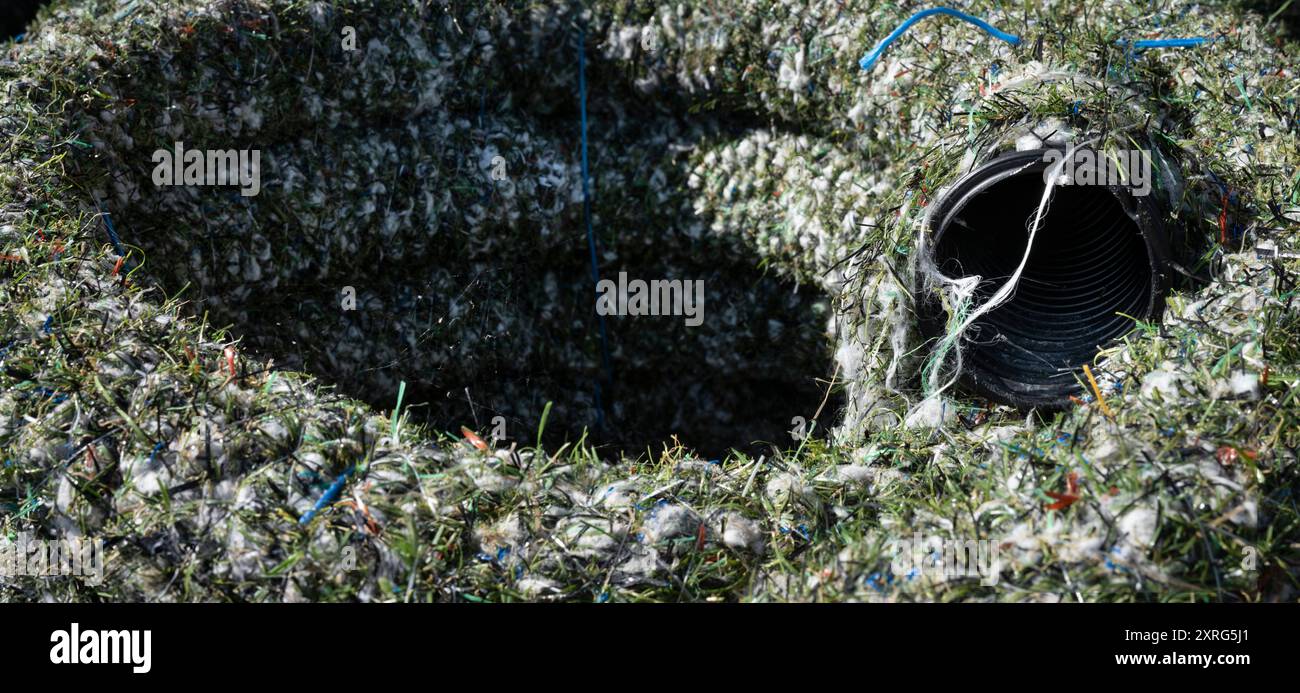 Coiled back plastic drainage pipe wrapped with artificial grass fibre ...