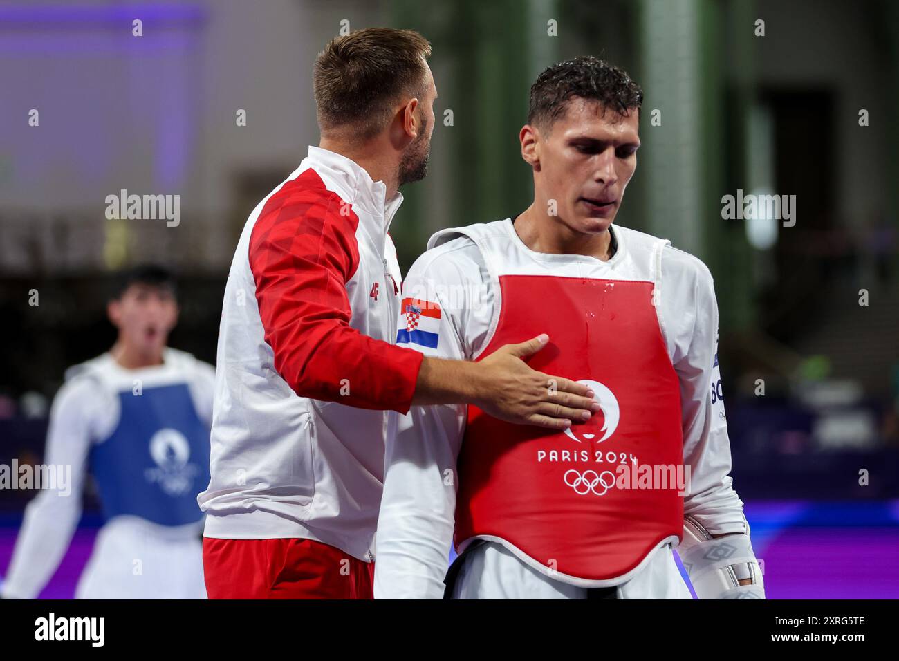 Paris, France. 10th Aug, 2024. Ivan Sapina of Croatia (red) reacts ...