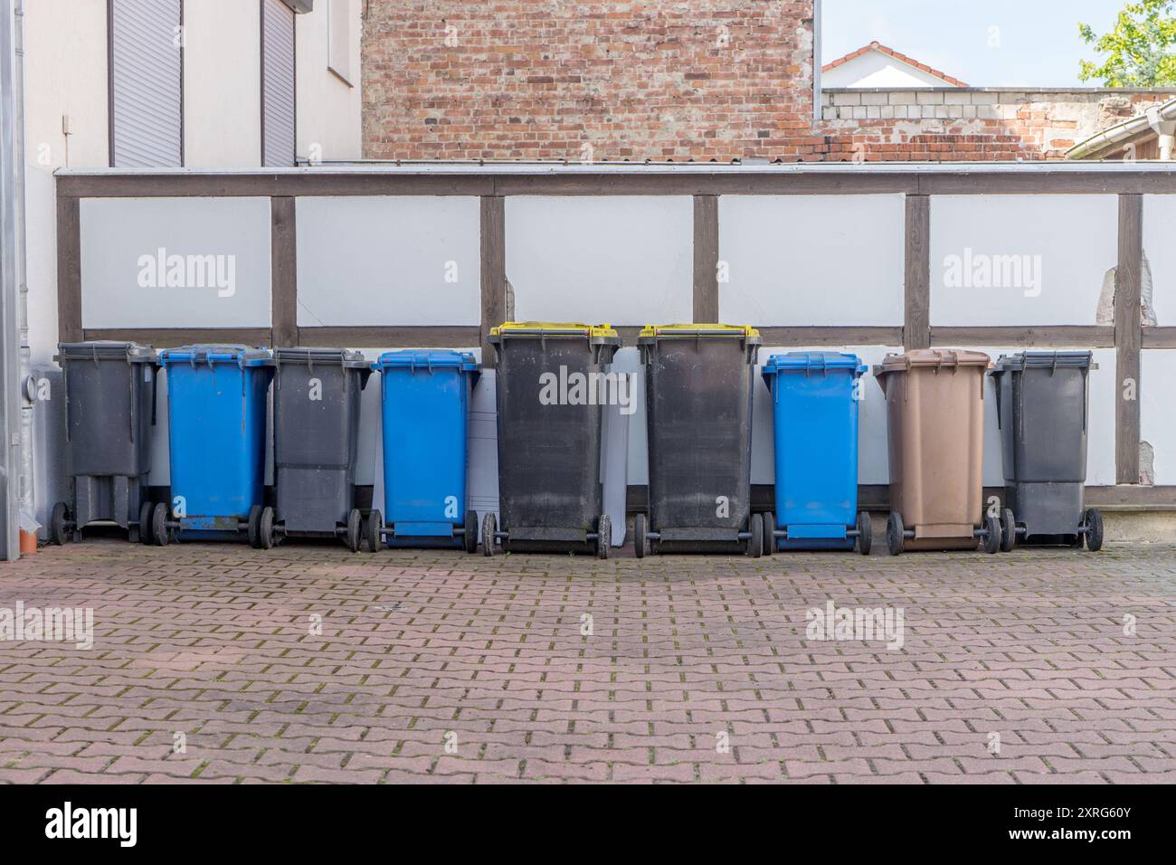 Row of garbage cans hi-res stock photography and images - Alamy