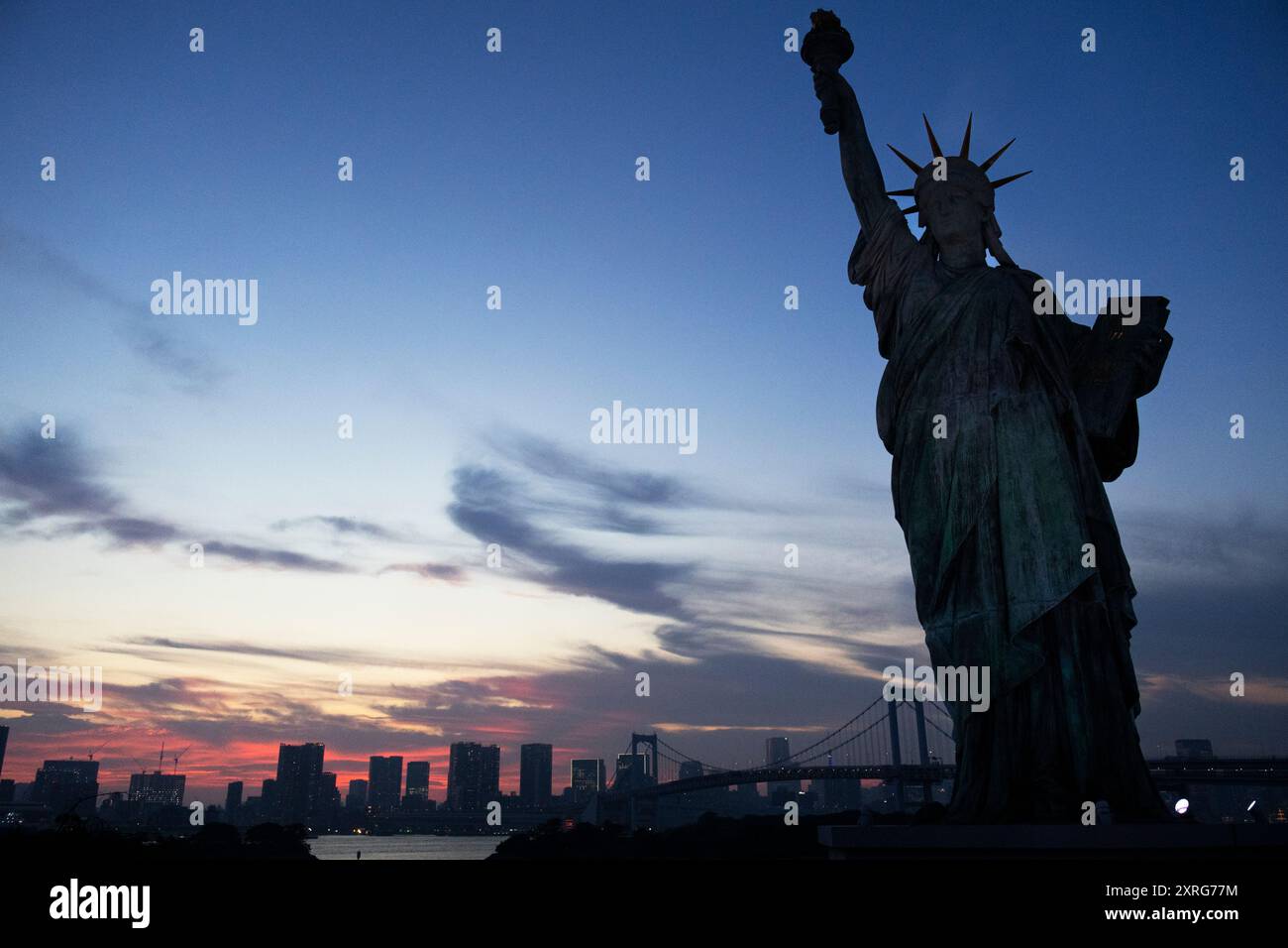 Statue of Liberty in Tokyo Bay Odaiba waterfront and Rainbow Bridge for ...