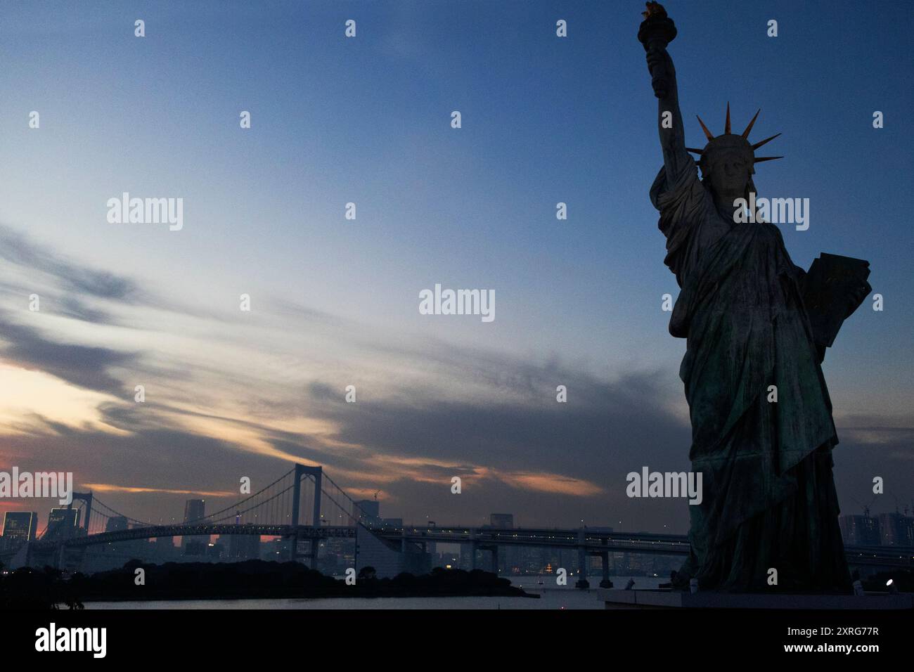 Statue of Liberty in Tokyo Bay Odaiba waterfront and Rainbow Bridge for ...