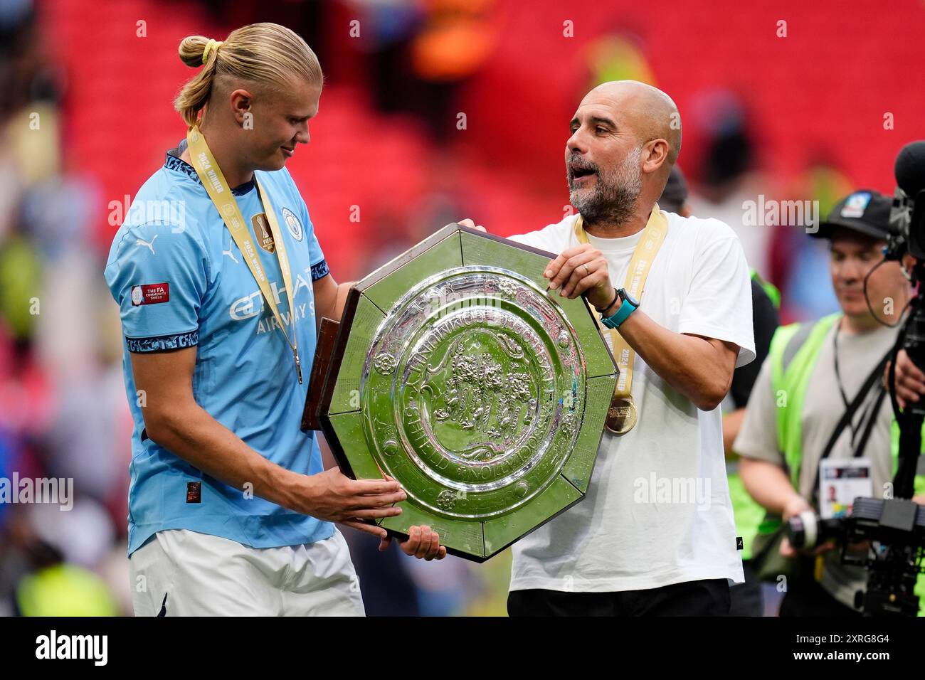 Manchester City's Erling Haaland (left) and Pep Guardiola celebrate ...