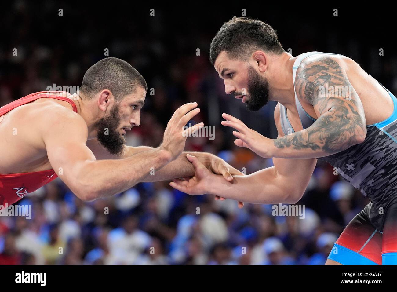 Azerbaijan's Magomedkhan Magomedov, in red, and Georgia's Givi ...