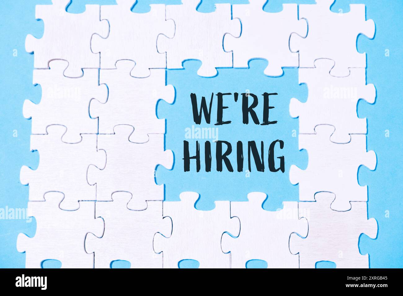 A puzzle with a white piece missing and the words We're hiring written ...