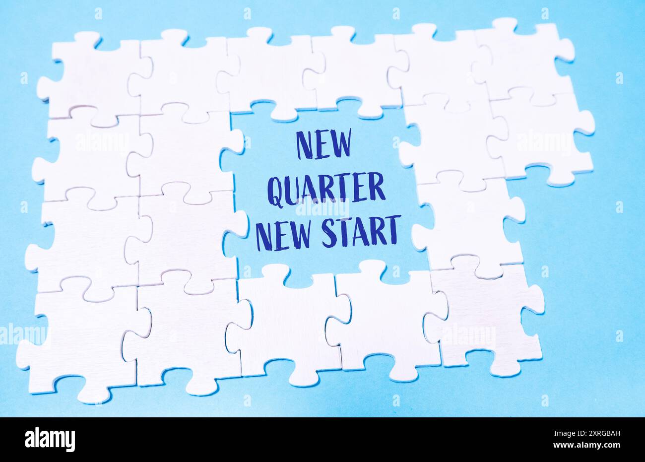 A puzzle with the words New Quarter New Start written in the middle ...